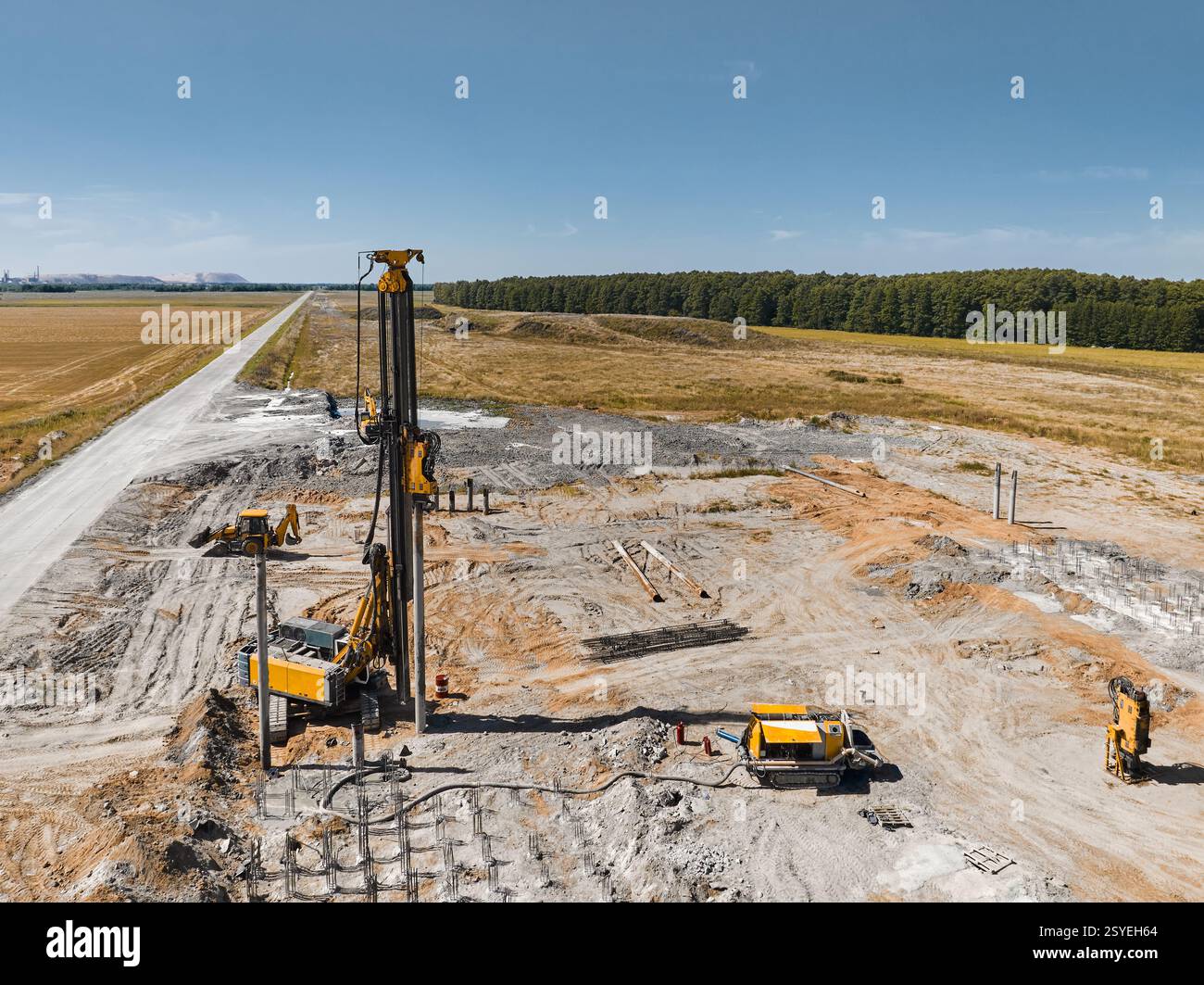 Drilling rig for constructing new mine on pile field Stock Photo - Alamy
