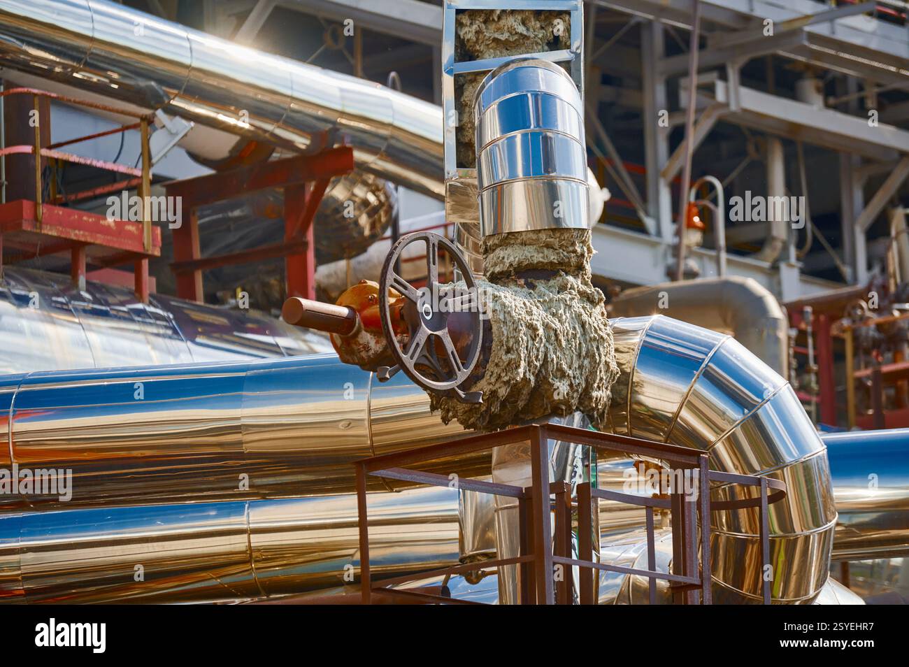 Close-up view of industrial chemical piping at a processing plant ...