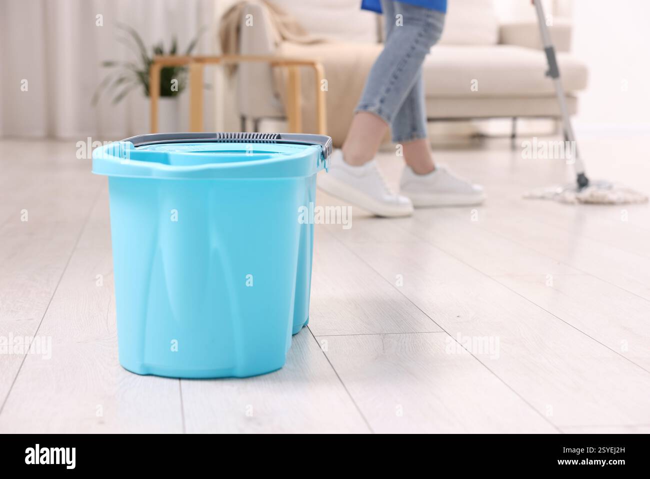 Woman mop on floor closeup hi-res stock photography and images - Alamy