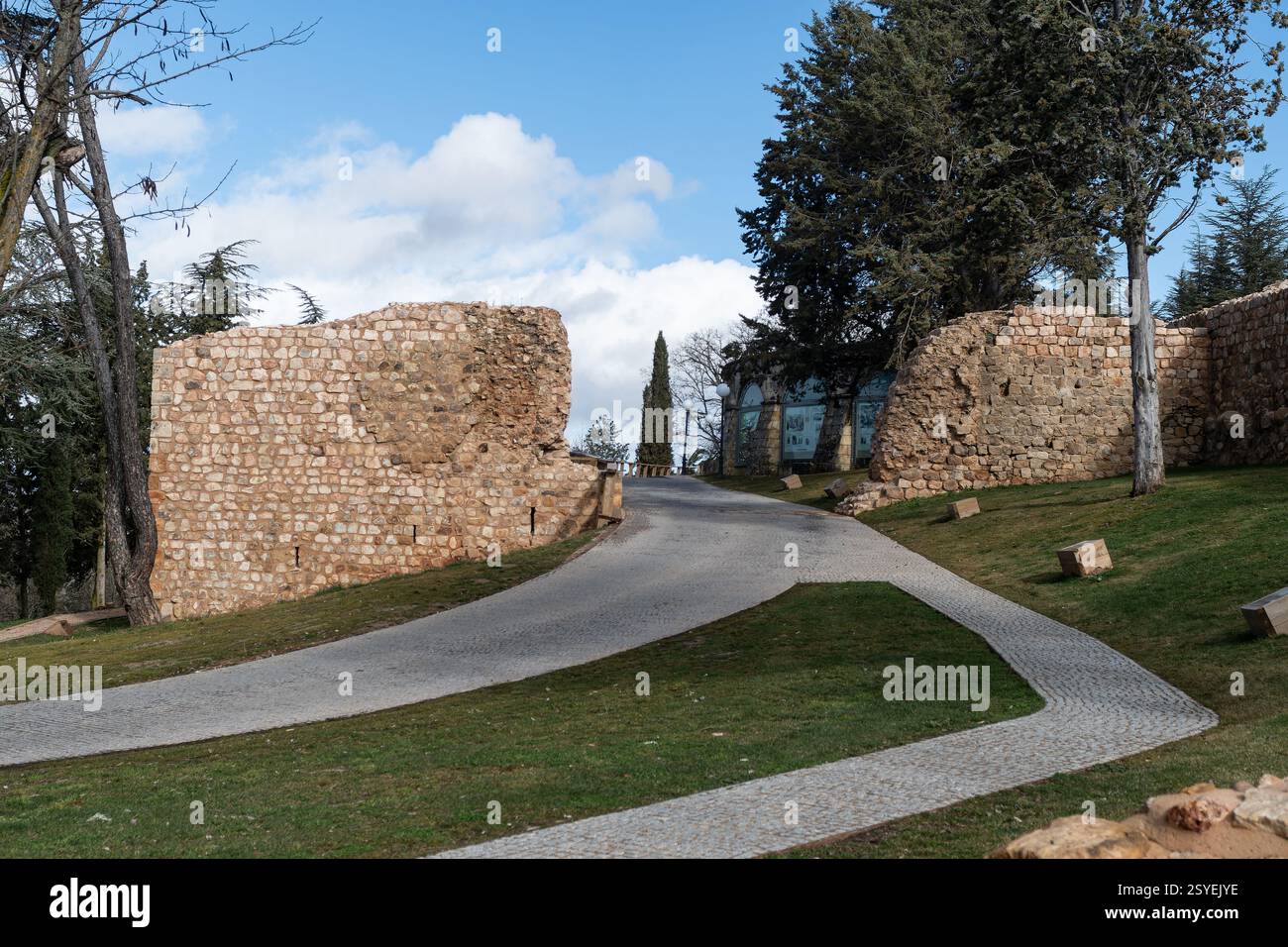 Medieval stone wall ruins in Soria, Spain, surrounded by greenery and ...