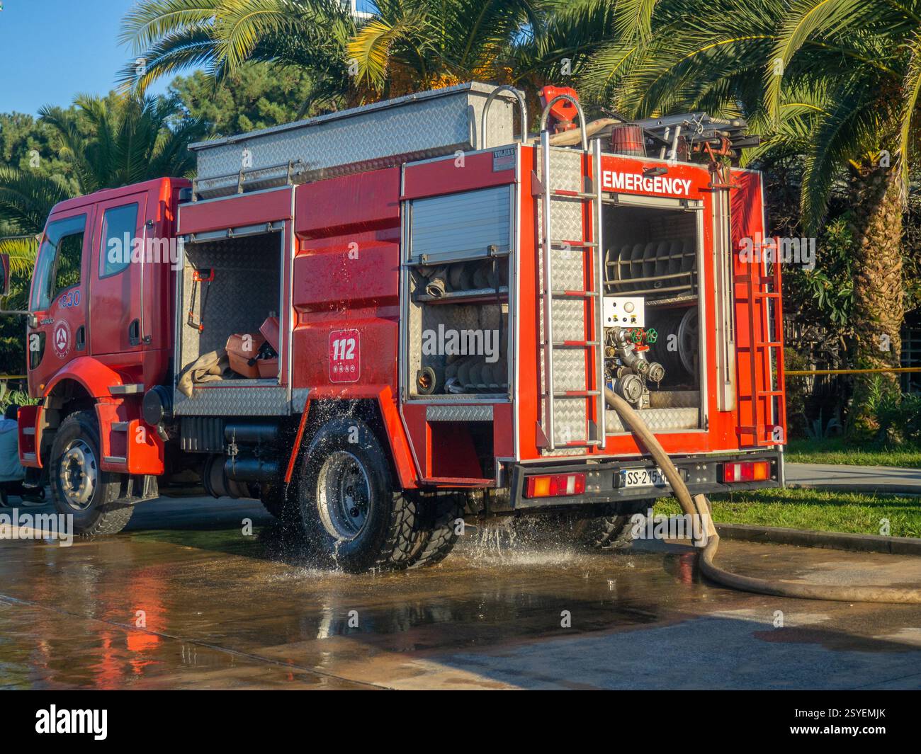 Fire engine at work. Pumps pump water. Fire extinguishing. Fire engine ...