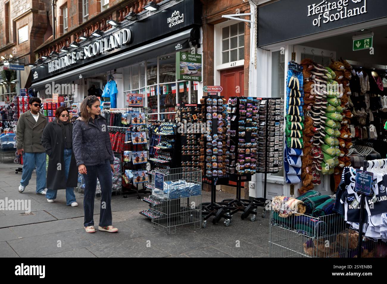 Tourist shops with merchandise displayed on the pavement in the ...