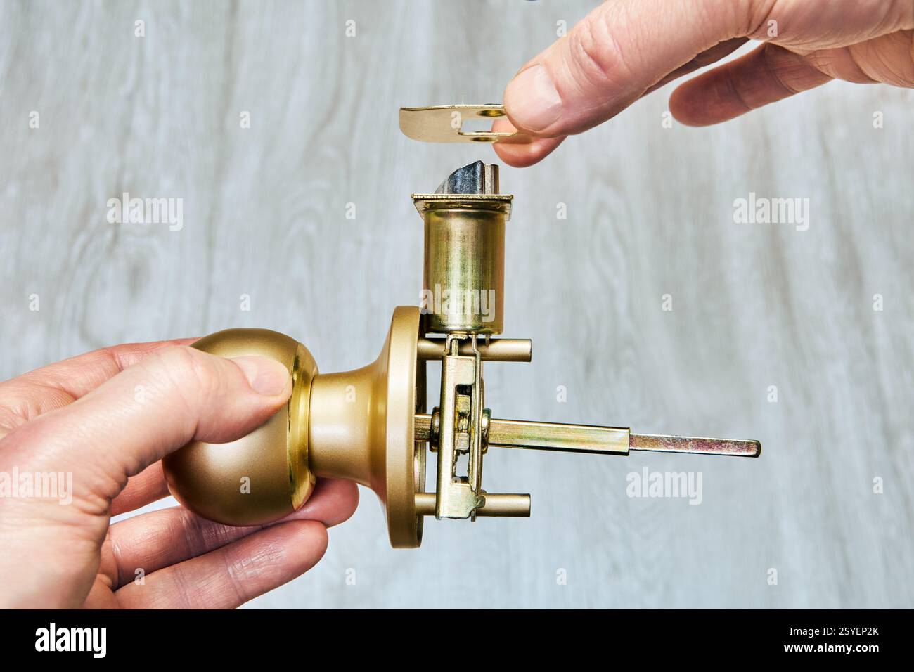 Close up view of brass door knob mechanism where spindle connects to ...