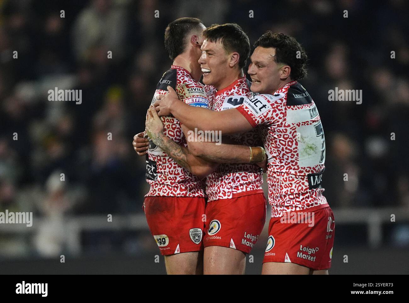 Leigh Leopards' Keanan Brand (centre) celebrates scoring a try against ...