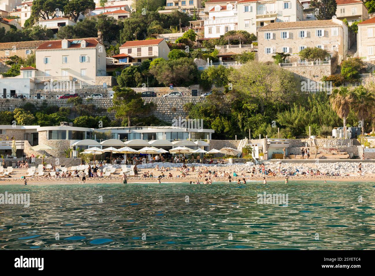 Banje Beach & tourists, with the Banje restaurant cafe. Beach is ...