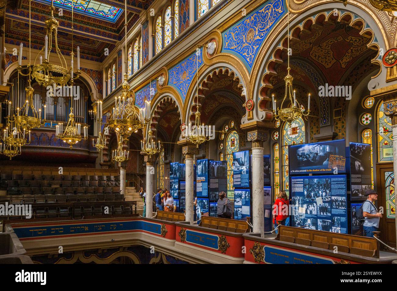 Interior view of a richly adorned synagogue featuring an elaborate ...