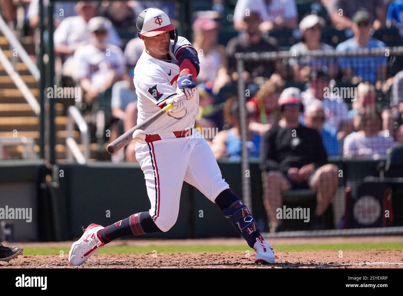 Minnesota Twins Jose Miranda hits a sacrifice fly to score a run in the ...