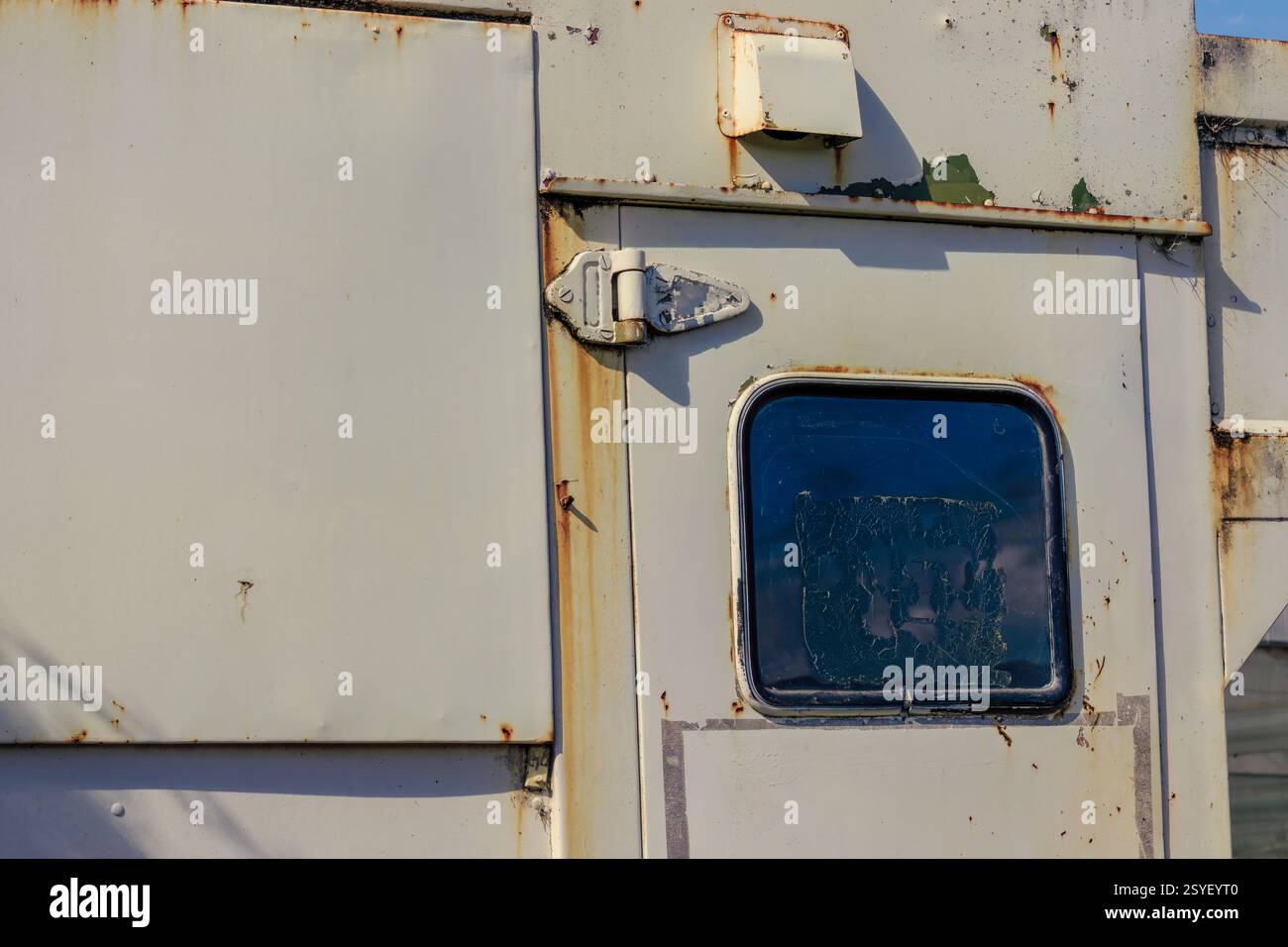 Close-up photography of the window of the door of an old rusty ...