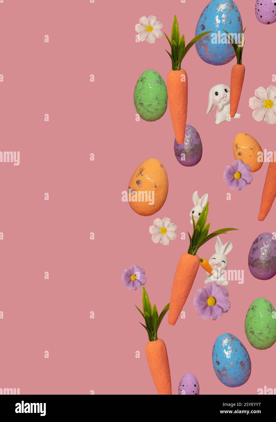 Easter layout made with carrots, eggs, flowers and bunnies on pastel ...