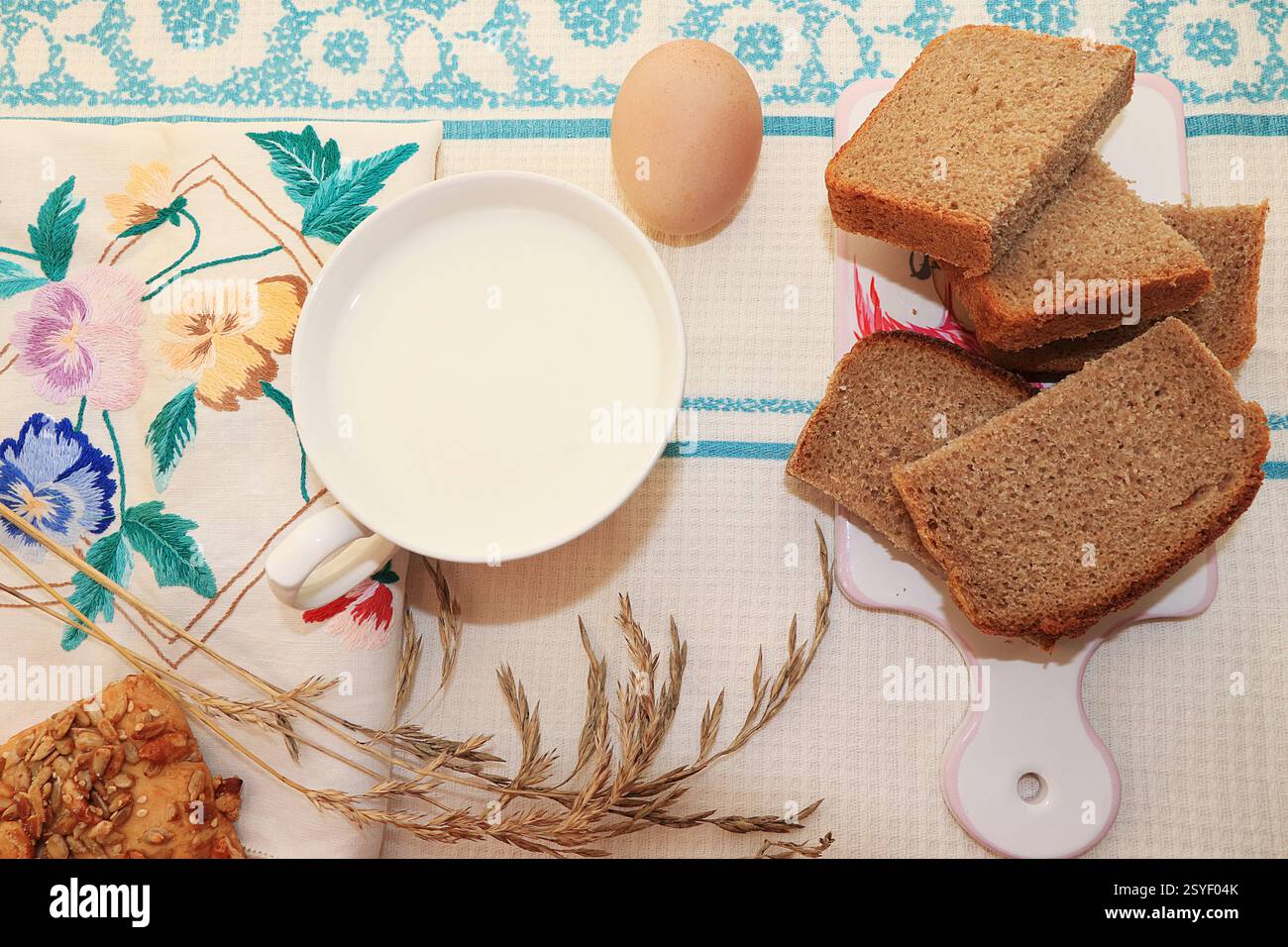 Country breakfast, milk and cereal bread, slices of cheese, healthy and ...