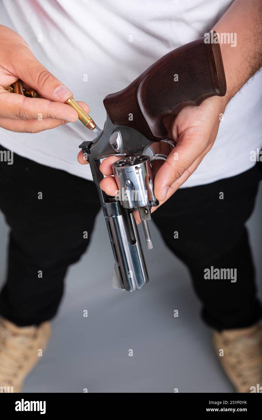Top down view of a shooting instructor wearing black pants and white ...