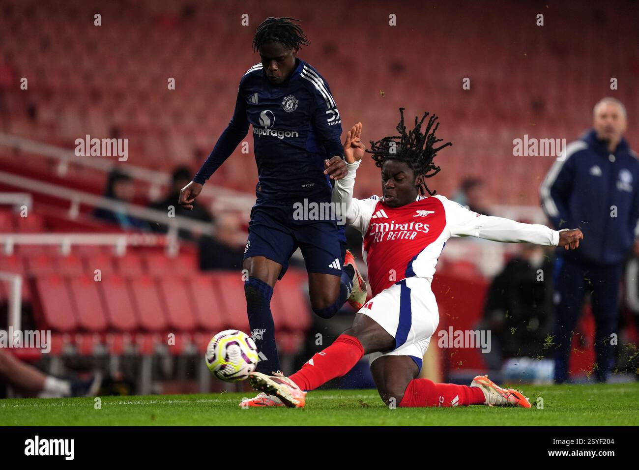 Manchester United's Bendito Mantato (left) is tackled by Arsenal's Josh ...