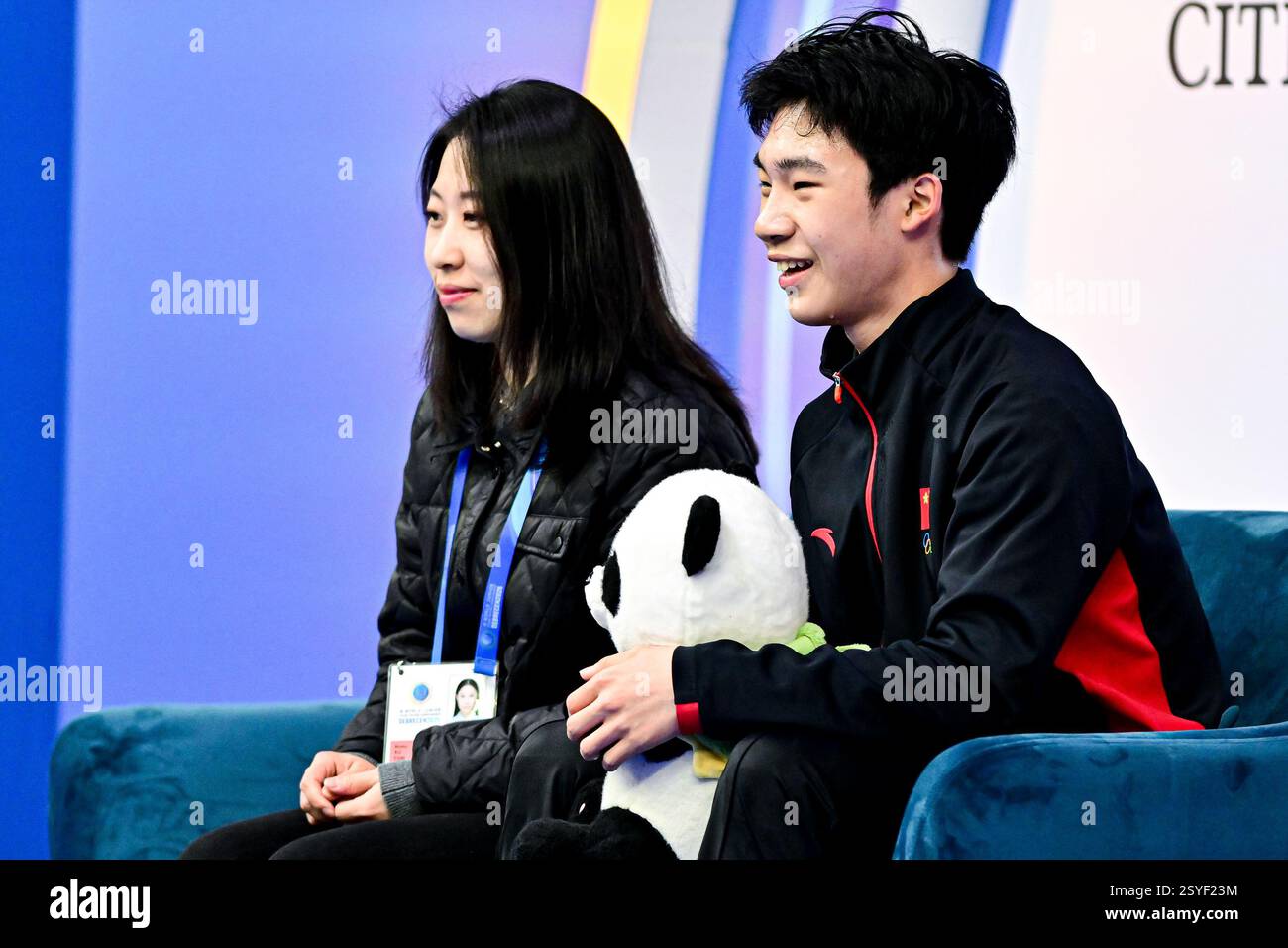 Tonghe TIAN (CHN), at Kiss & Cry, during Junior Men Free Skating, at the ISU World Junior Figure ...