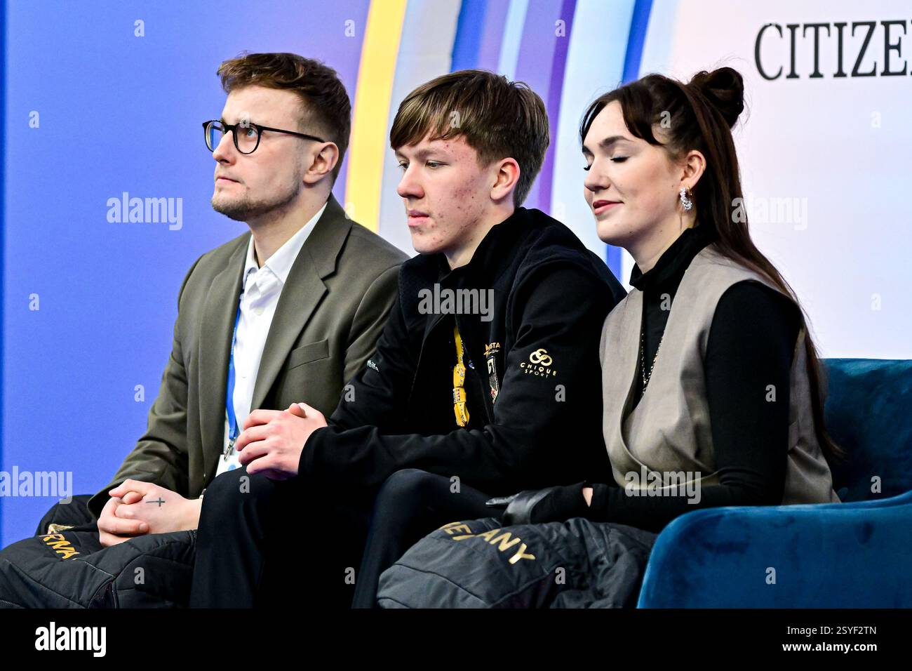 Genrikh GARTUNG (GER), at Kiss & Cry, during Junior Men Free Skating ...
