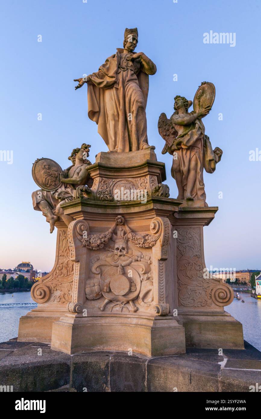 A statue of a regal figure with a crown and ornate attire, surrounded ...