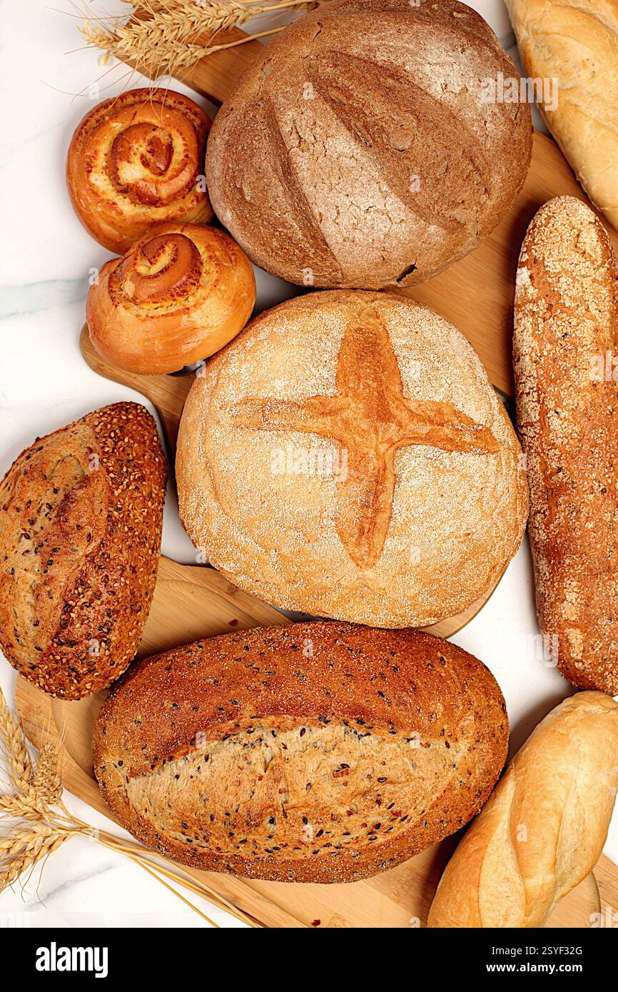Freshly baked whole grain homemade bread, different types of round ...
