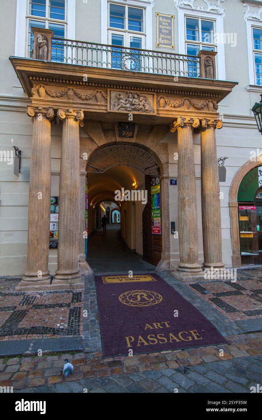 A stone archway with classical columns and decorative elements frames ...