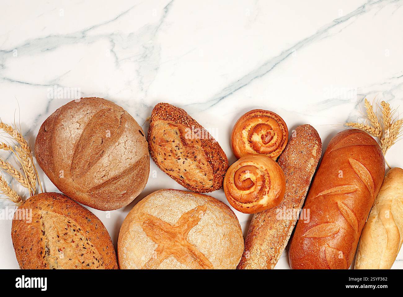 Freshly baked whole grain homemade bread, different types of round ...