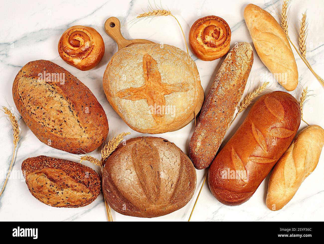 Freshly baked whole grain homemade bread, different types of round ...