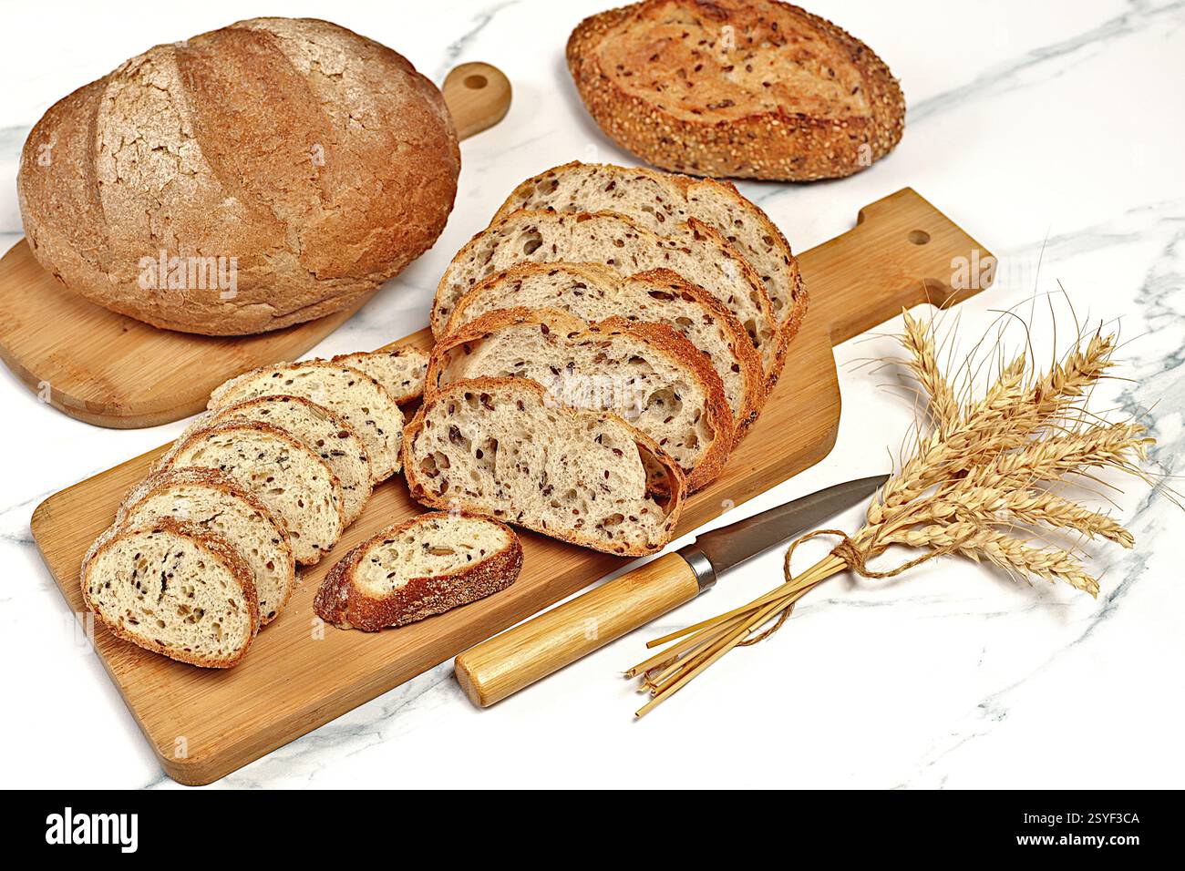 Freshly baked whole grain homemade sourdough bread with crispy crust ...