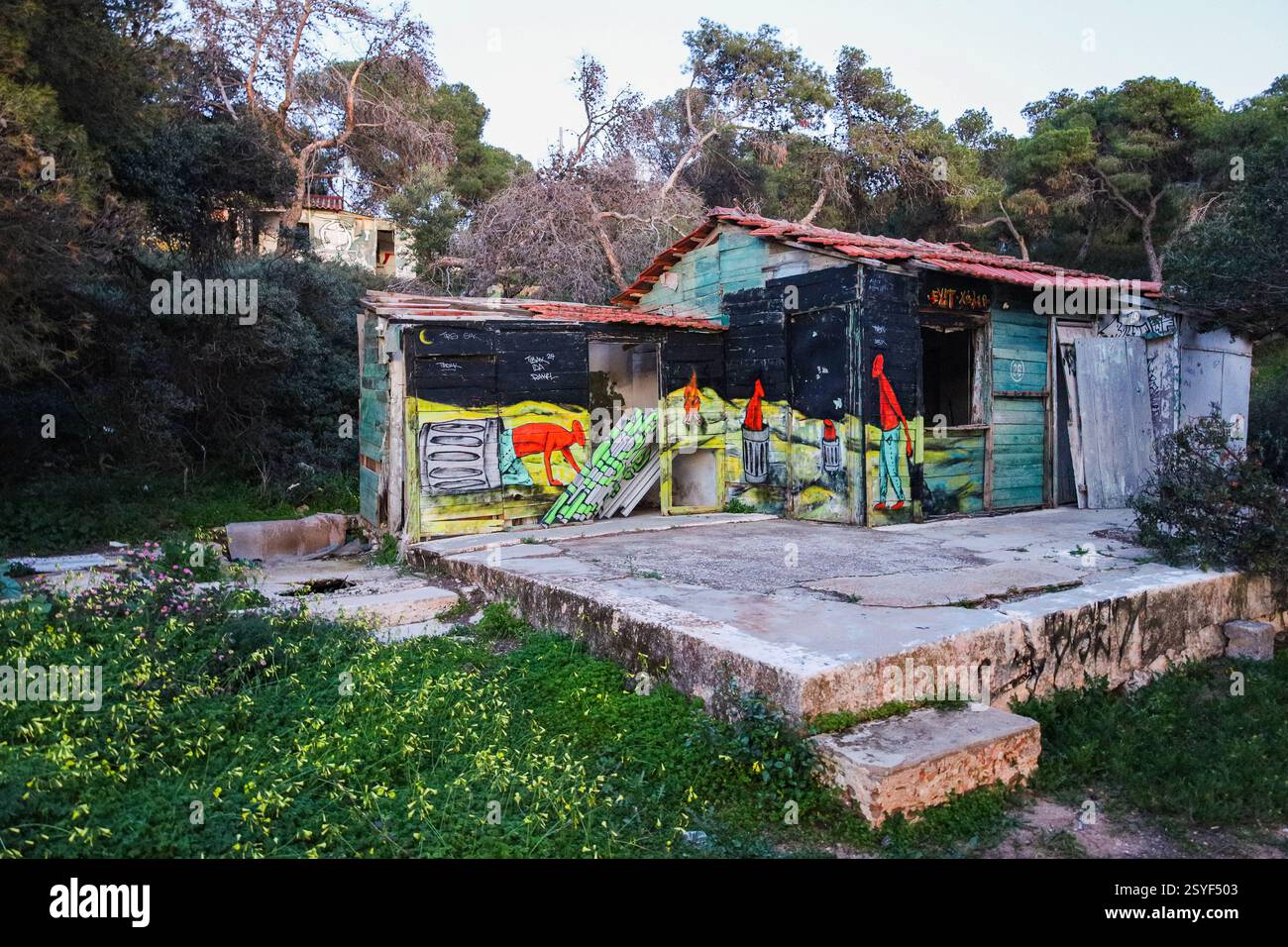 Vouliagmeni, Greece - February 28, 2025. An old, dilapidated wooden ...
