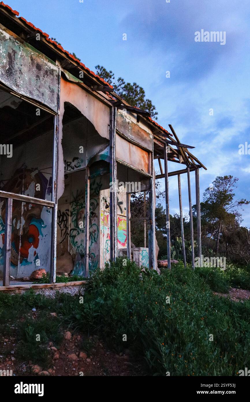 Vouliagmeni, Greece - February 28, 2025. An old, dilapidated wooden ...