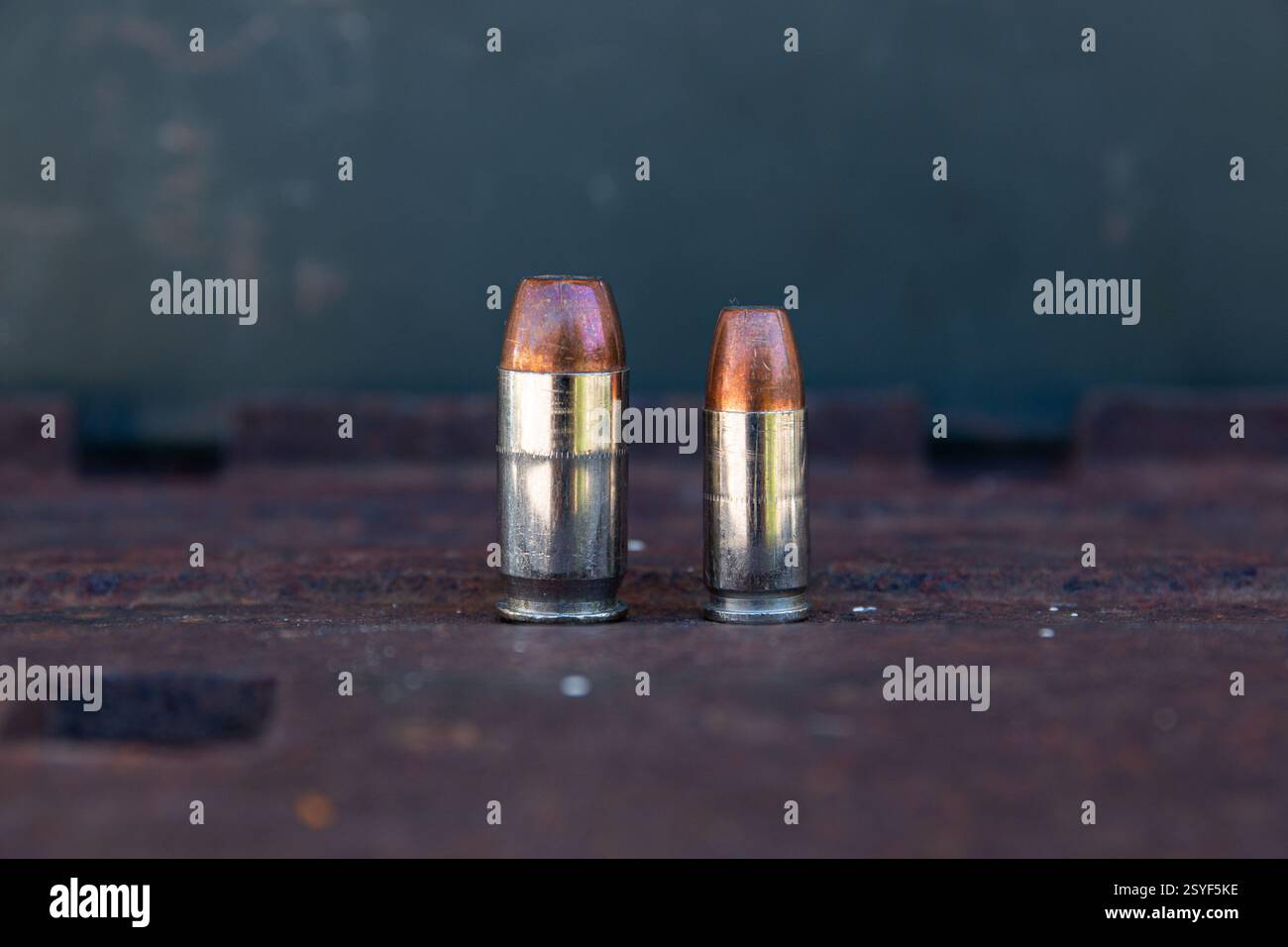 Comparing the sizes between a .45 ACP and 9mm cartridge. The much ...