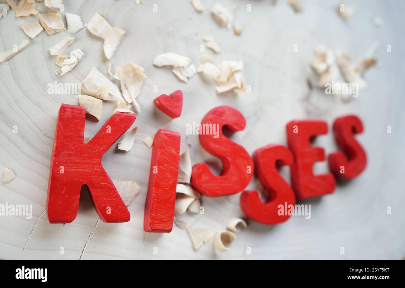 Hand crafted, wooden letters. celebrating love. red letters spelling ...