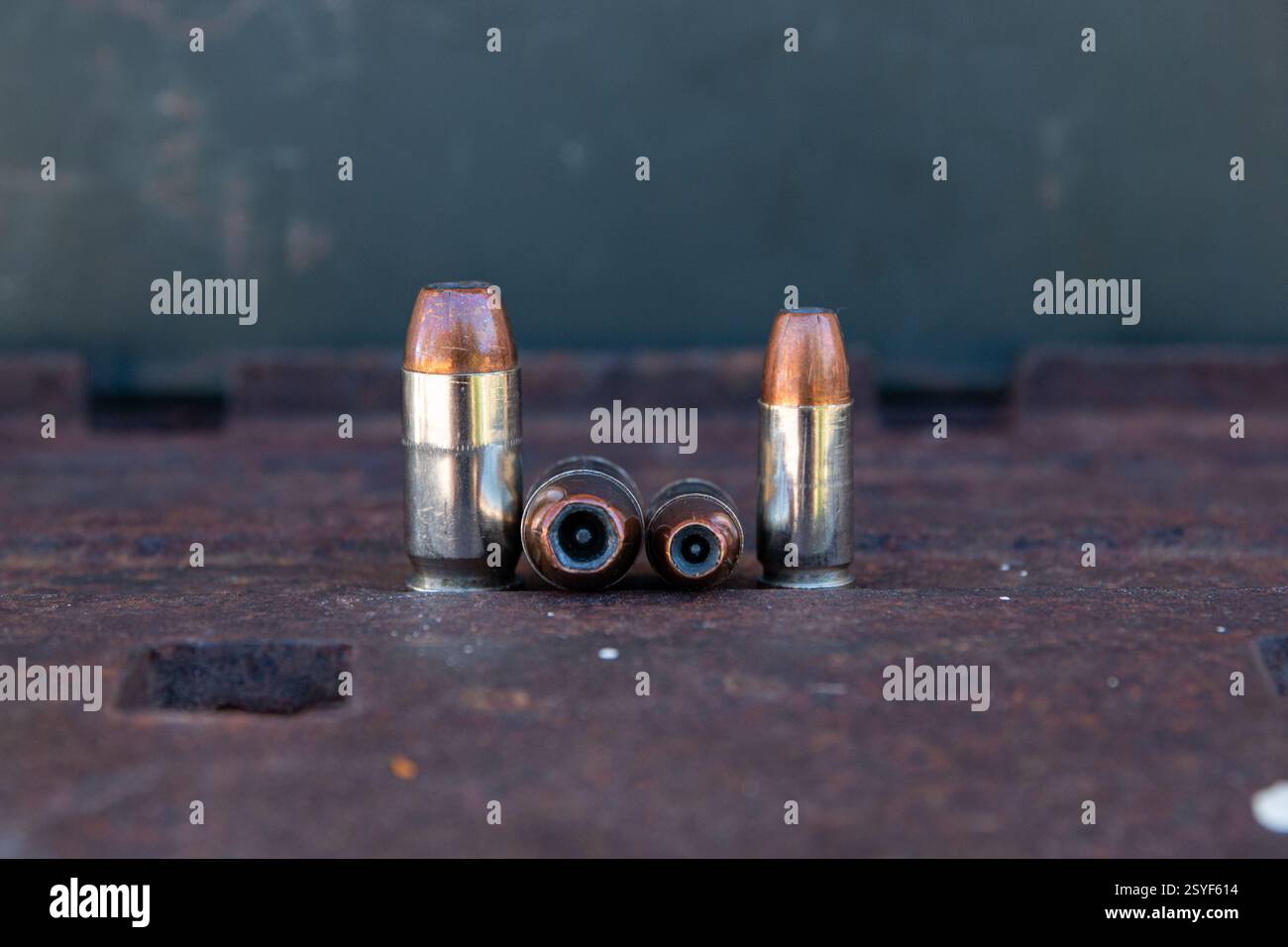Comparing the sizes between a .45 ACP and 9mm cartridge. The much ...
