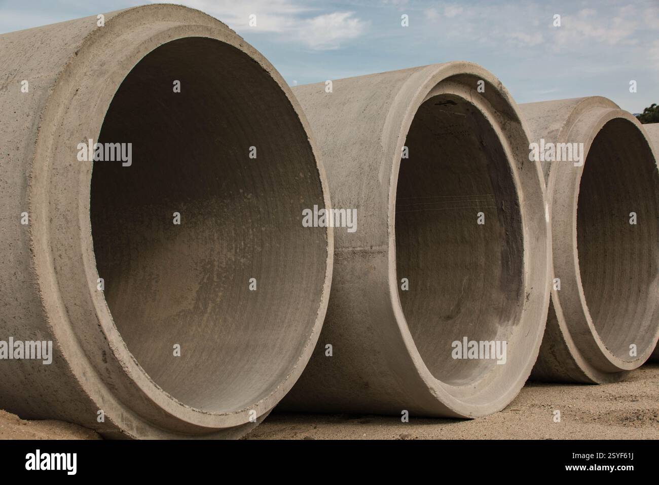 Large concrete pipes at a construction site for underground sewer ...