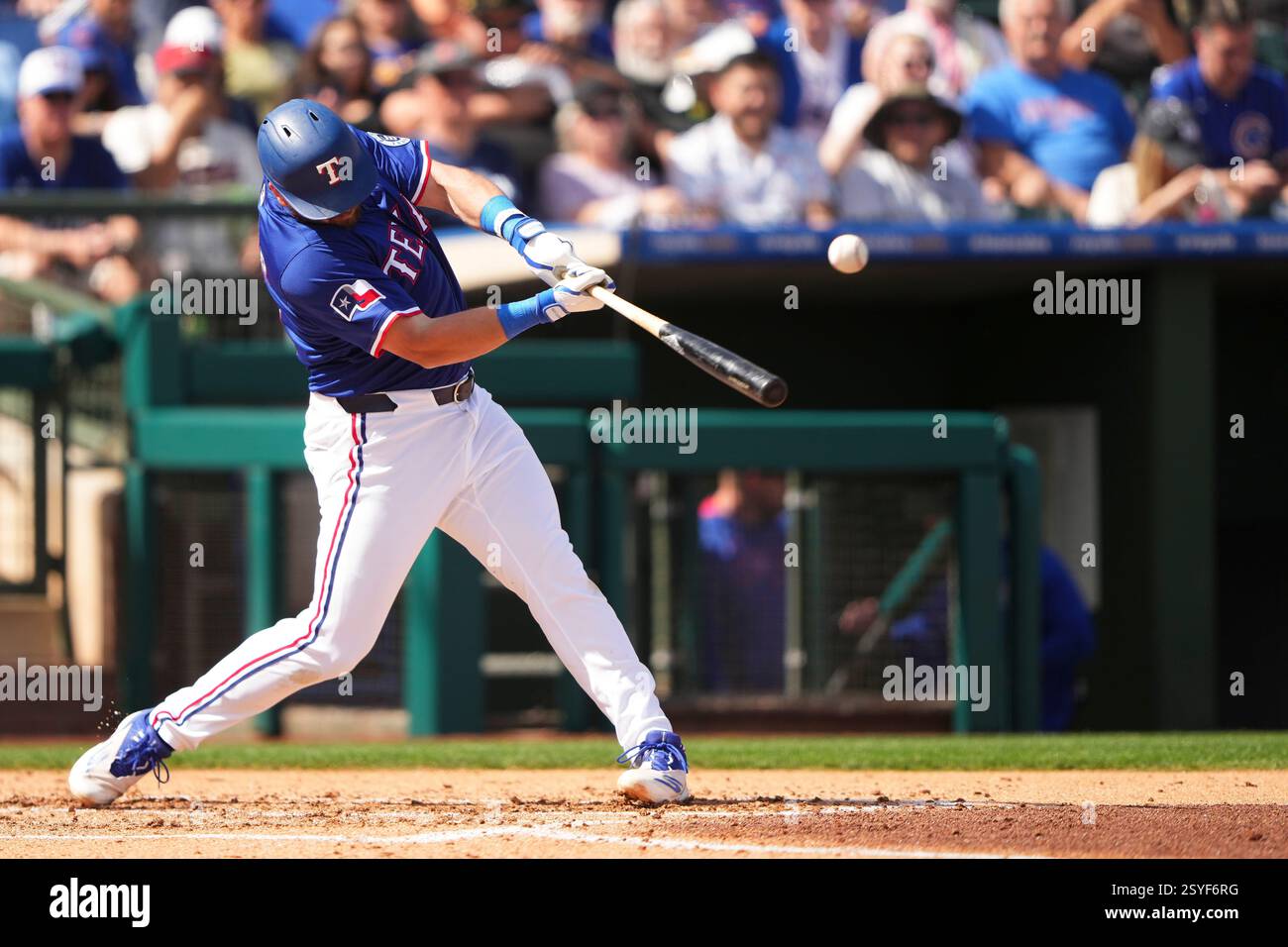 Texas Rangers' Jake Burger hits a single against the Chicago Cubs ...