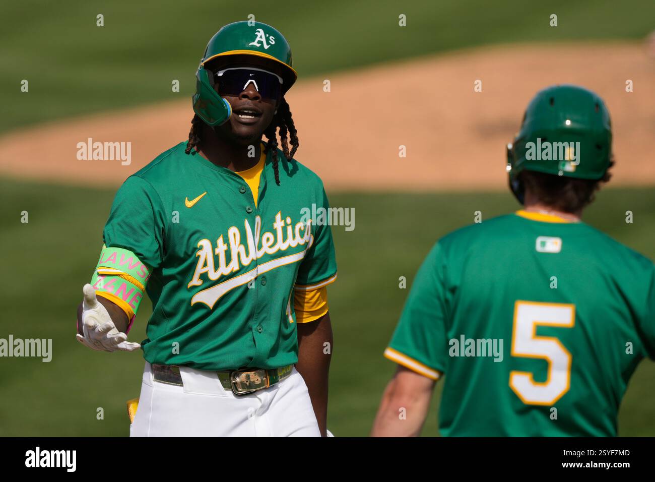 Athletics' Lawrence Butler, left, celebrates after his three-run home ...