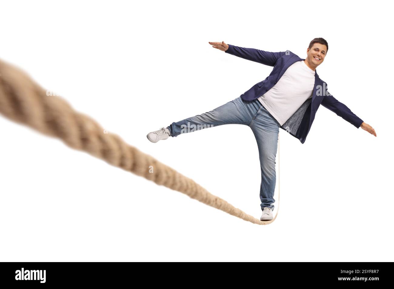 Young man walking on edge hi-res stock photography and images - Alamy