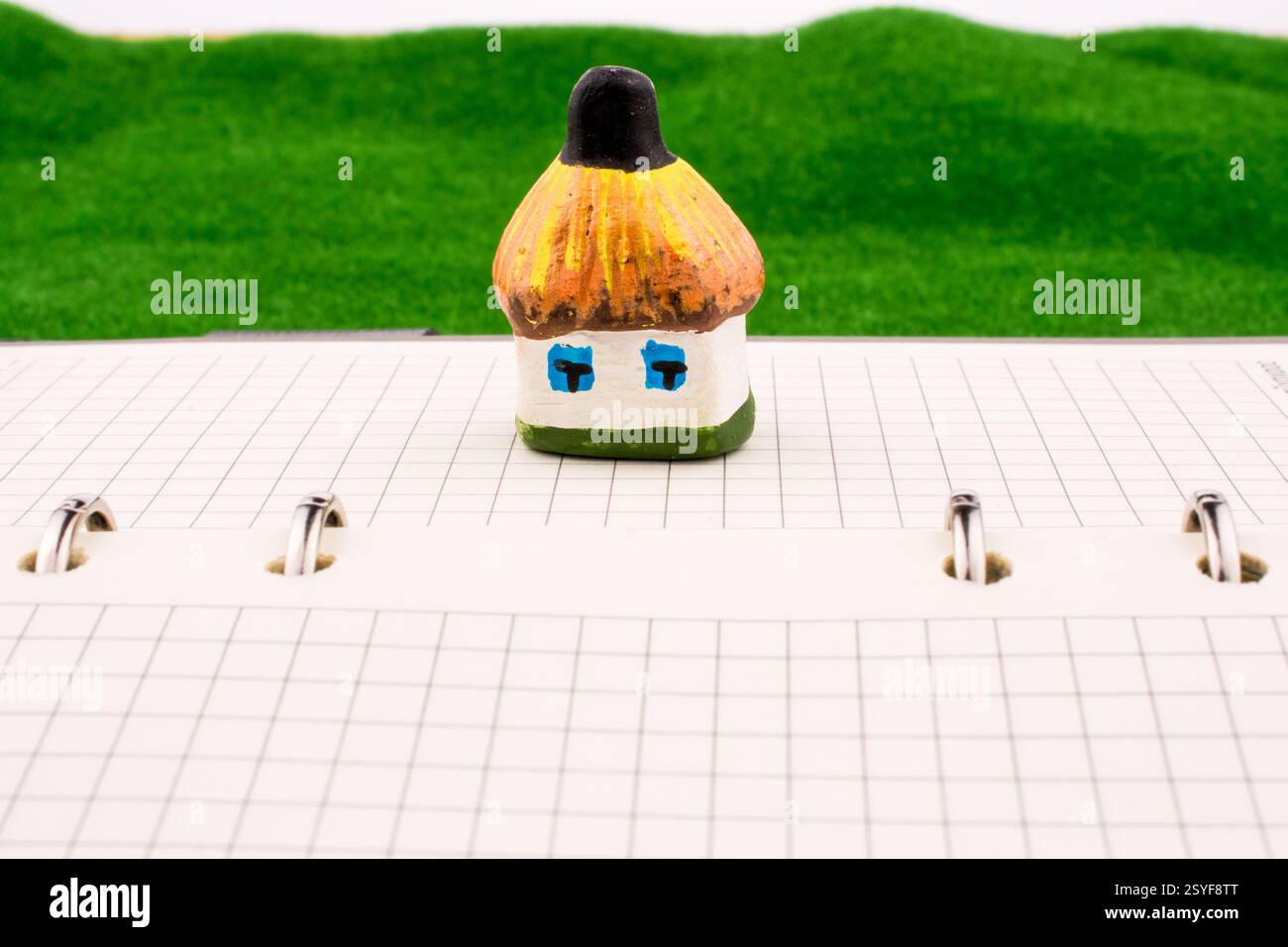 Hut model on a spiral notebook Stock Photo - Alamy