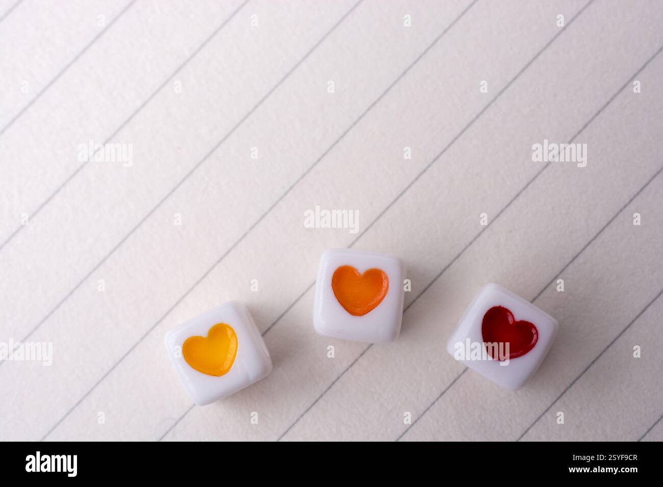 Colorful cubes with a heart placed on paper Stock Photo - Alamy
