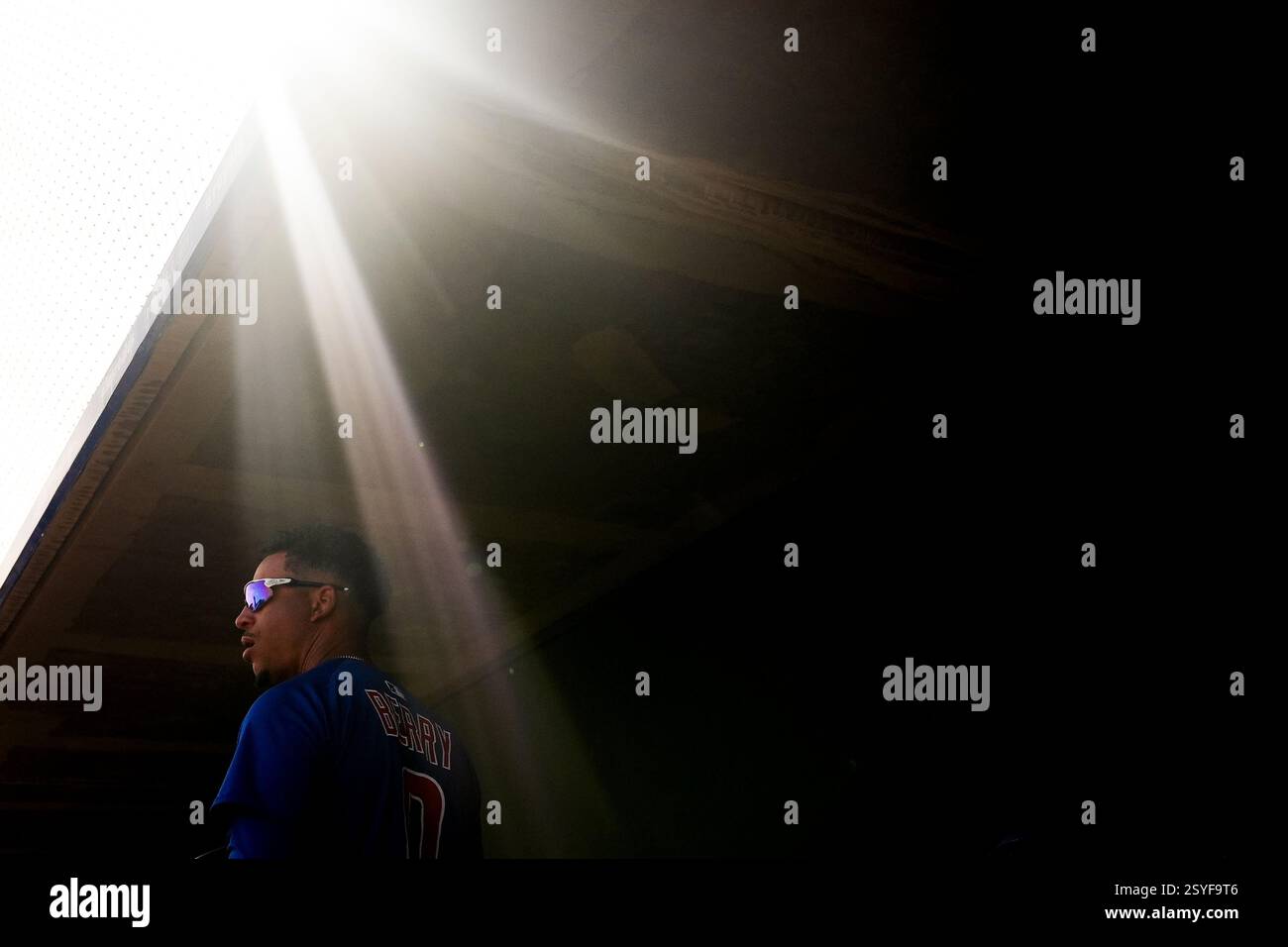 Chicago Cubs third base coach Quintin Berry stands in the dugout during ...