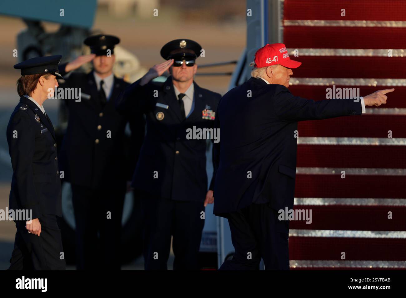 President Donald Trump, right, gestures as is escorted by Air Force Col ...