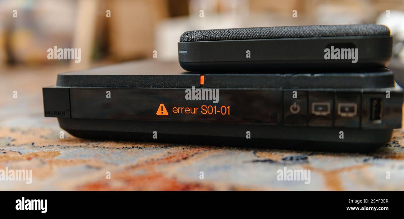 Paris, France - Feb 17, 2025: A close-up of an Orange TV decoder ...