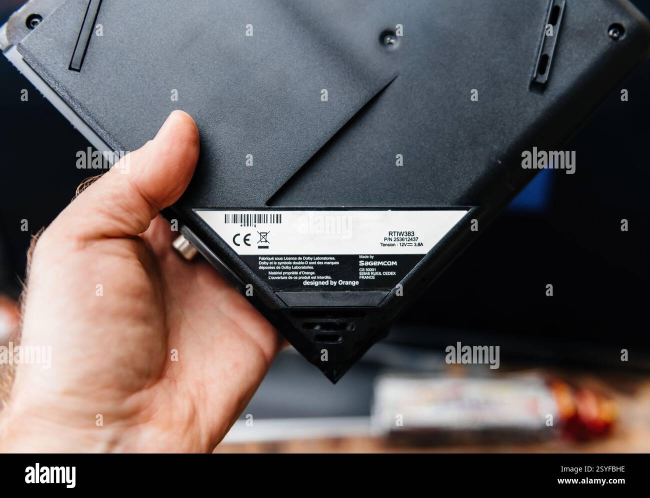 Paris, France - Feb 17, 2025: A person holds an older model of an ...