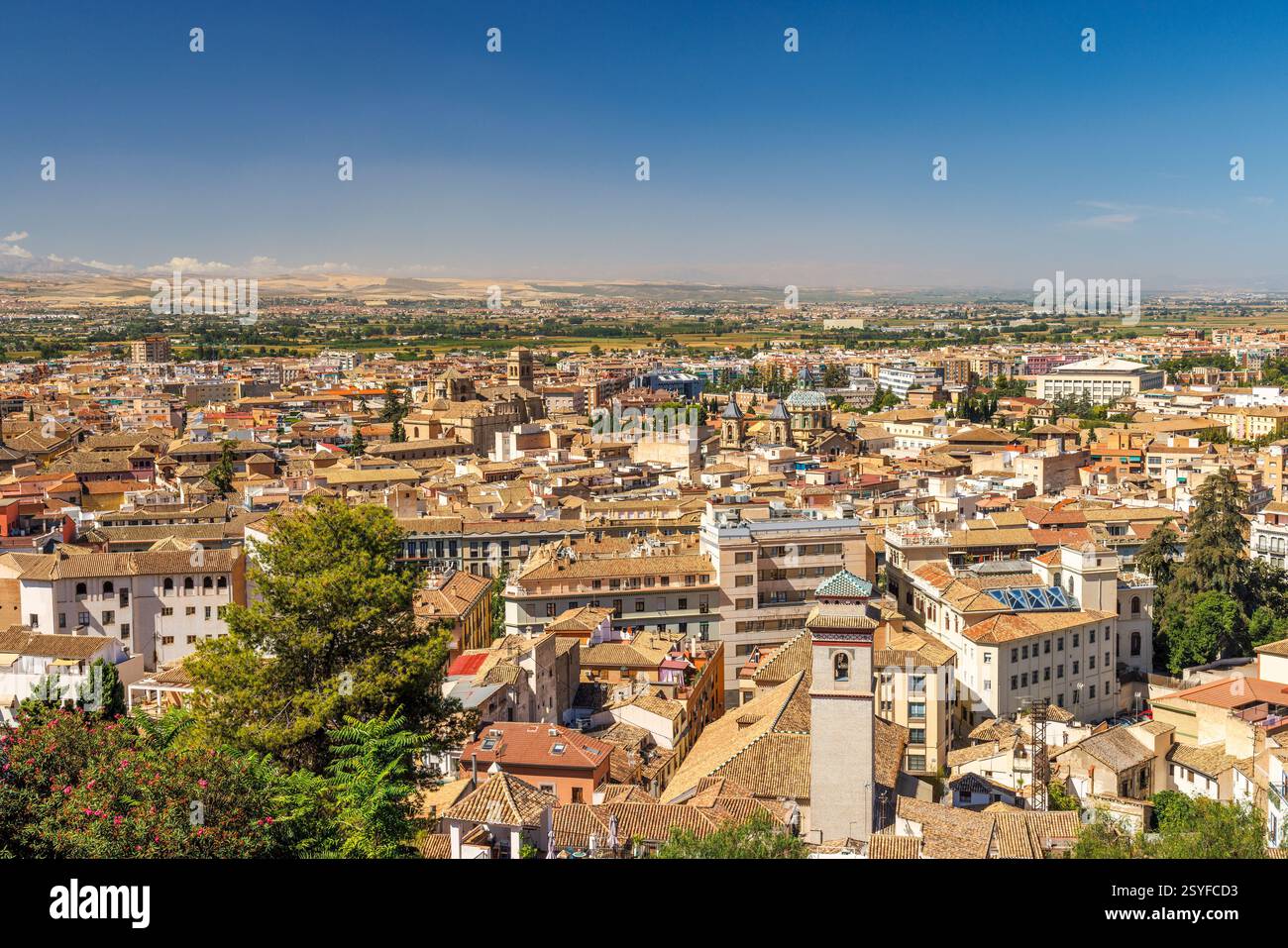 Granada town in Spain. Panoramic view of a historic city under a clear ...
