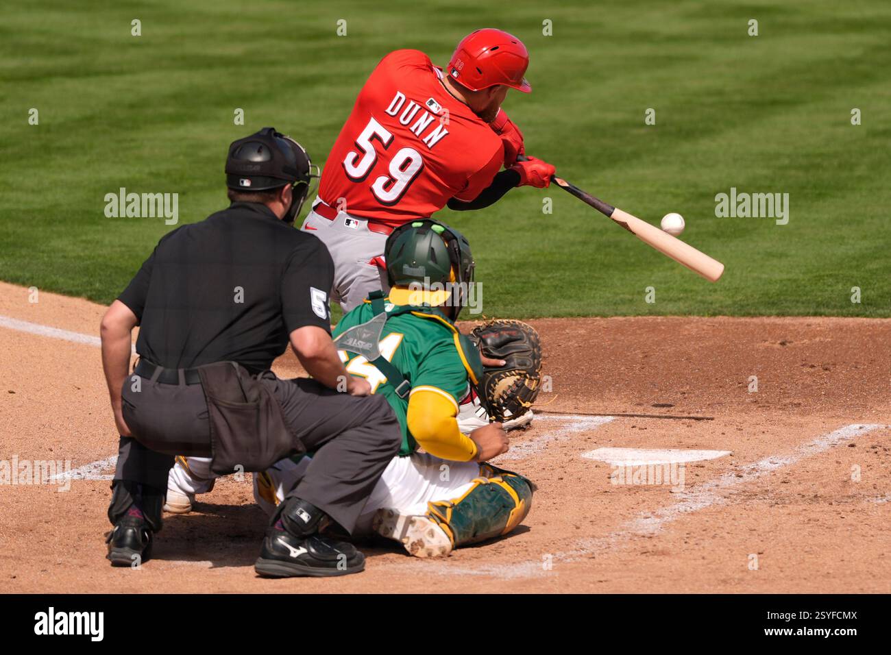 Cincinnati Reds Blake Dunn (59) hits an RBI single to score Will Benson ...
