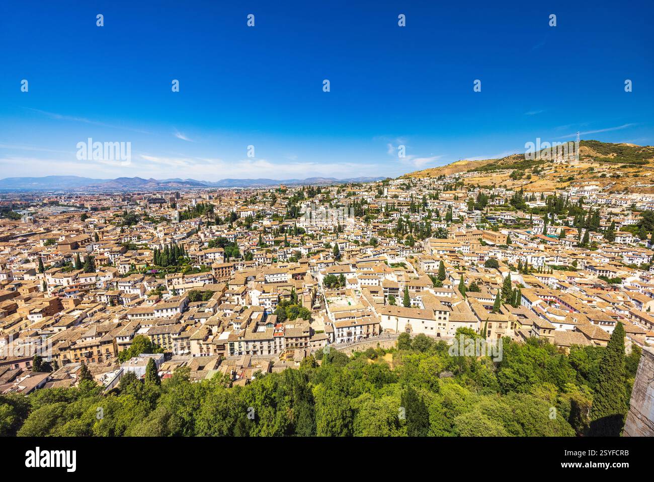 Granada town in Spain. Panoramic view of a city nestled against a hill ...