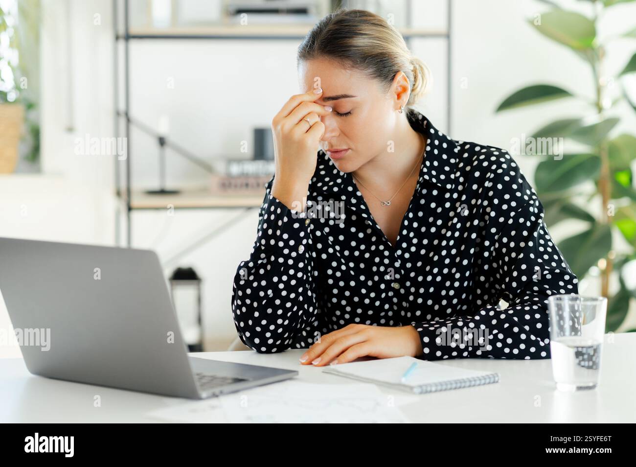 Sad exhausted stressed business woman, office secretary, sitting at the ...