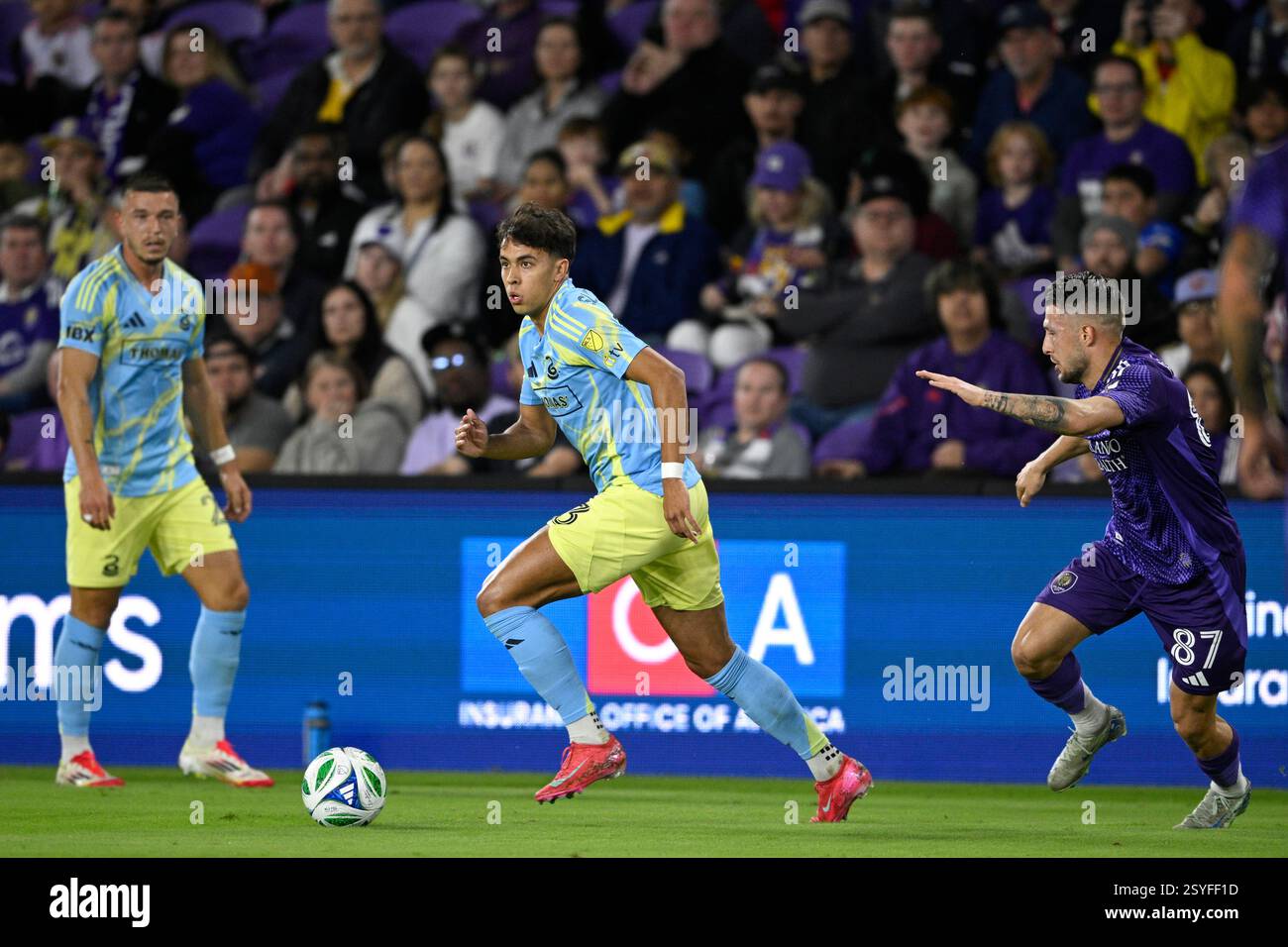 Philadelphia Union midfielder Quinn Sullivan, center, controls the ball ...