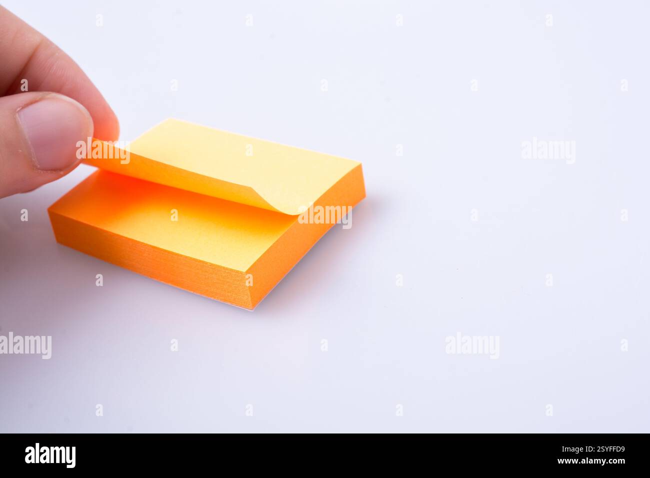 Post note office sticker for taking notes in hand Stock Photo - Alamy