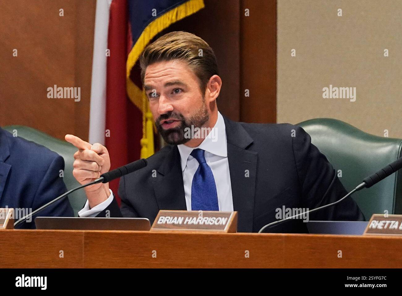 Texas State Rep. Jeff Leach, R-Plano, right, poses a question to a witness during a committee ...