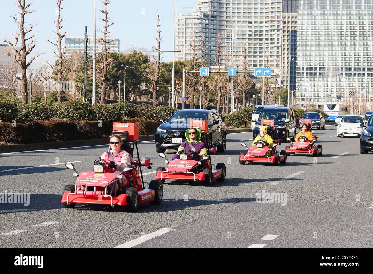 TOKYO, JAPAN - February 15, 2025: Tourists driving rental go-carts on a ...