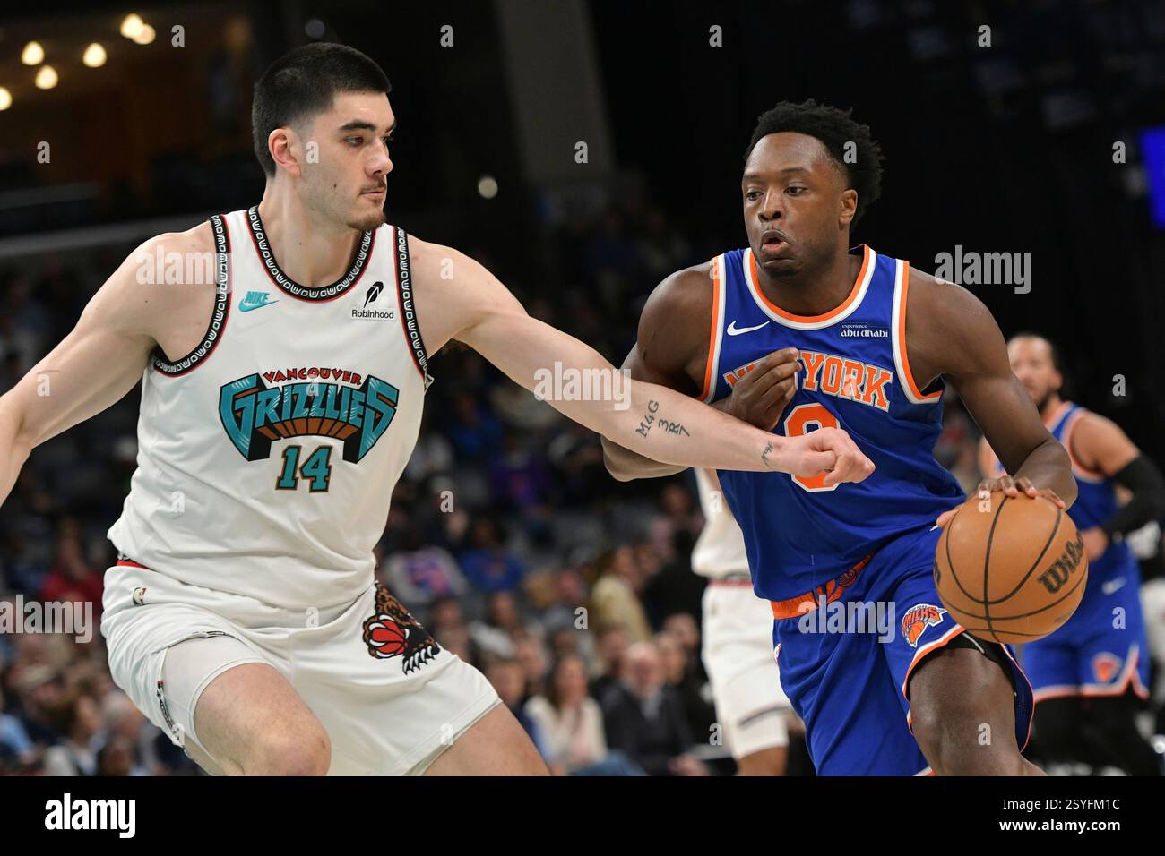 New York Knicks forward OG Anunoby (8) handles the ball against Memphis Grizzlies center Zach ...