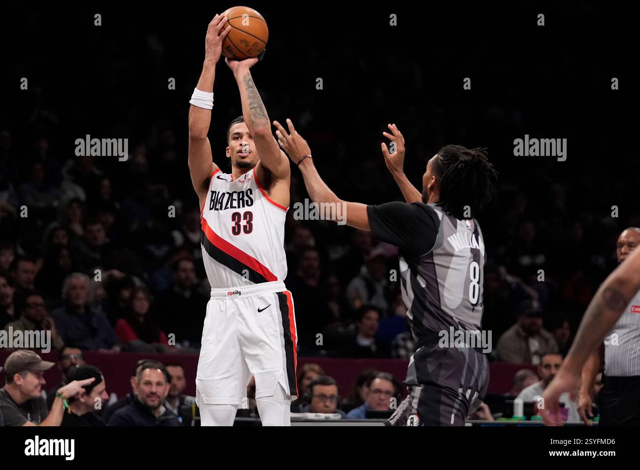 Brooklyn Nets' Nic Claxton (33) shoots over Brooklyn Nets' Ziaire ...
