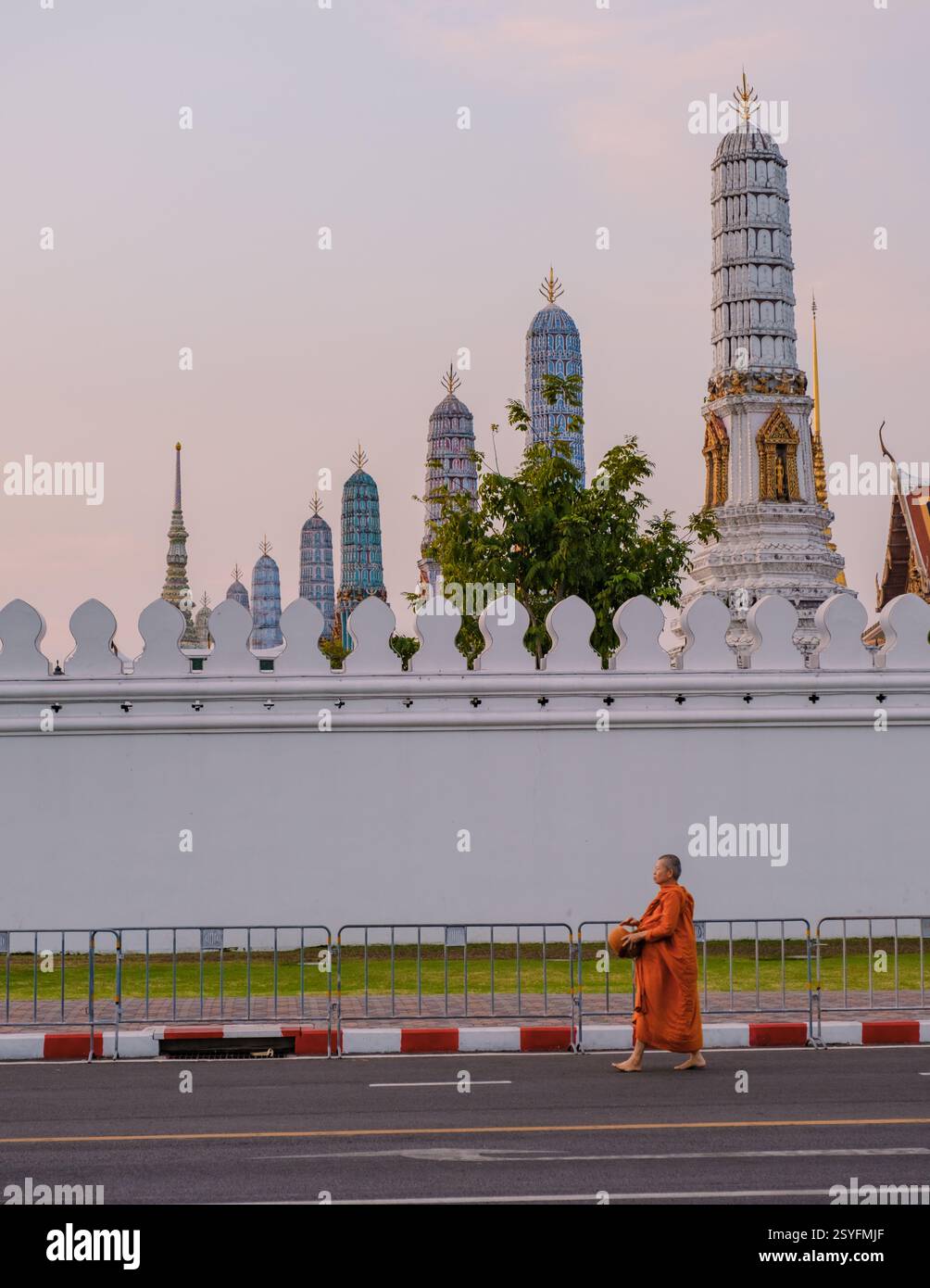 Bangkok Thailand 10 January 2025, a solitary monk walks along a quiet ...